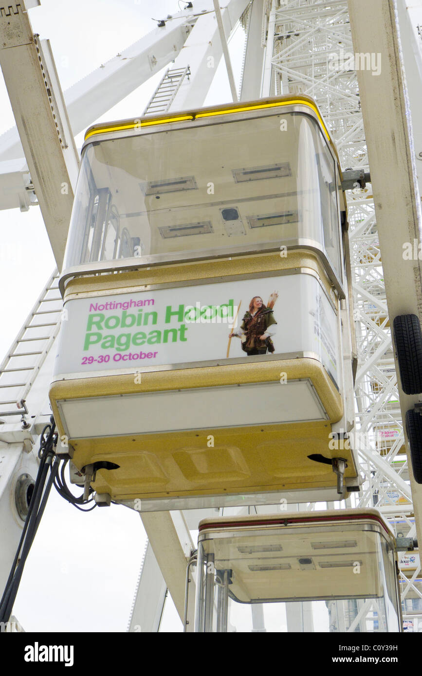 A CARRIAGE ON THE NOTTINGHAM BIG WHEEL, SHOWS ADVERT FOR ROBIN HOOD ...
