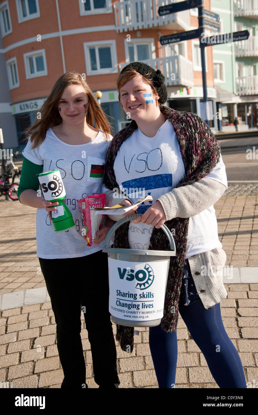 Two women collecting money hi-res stock photography and images - Alamy