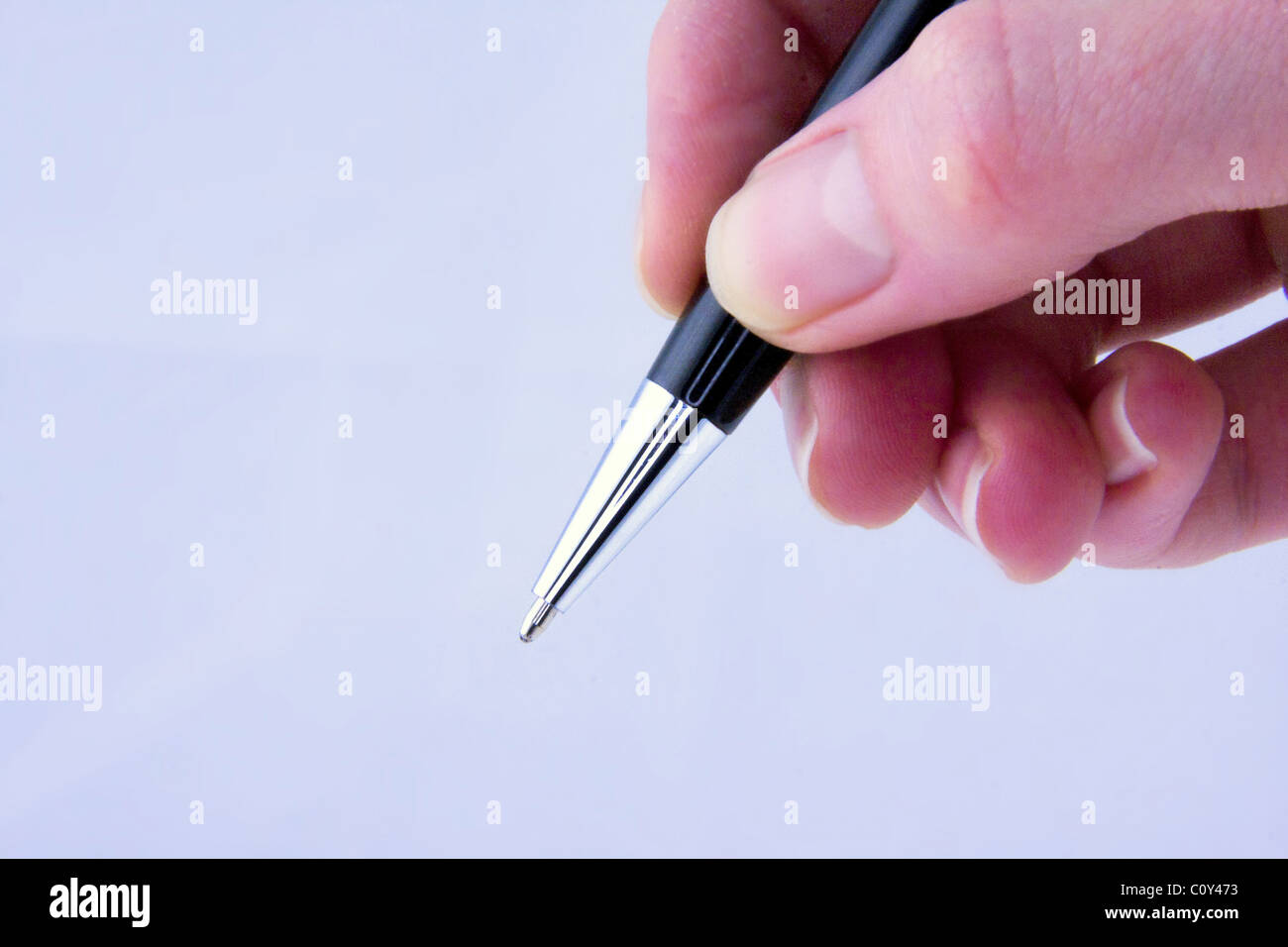 Hand and pen Stock Photo - Alamy