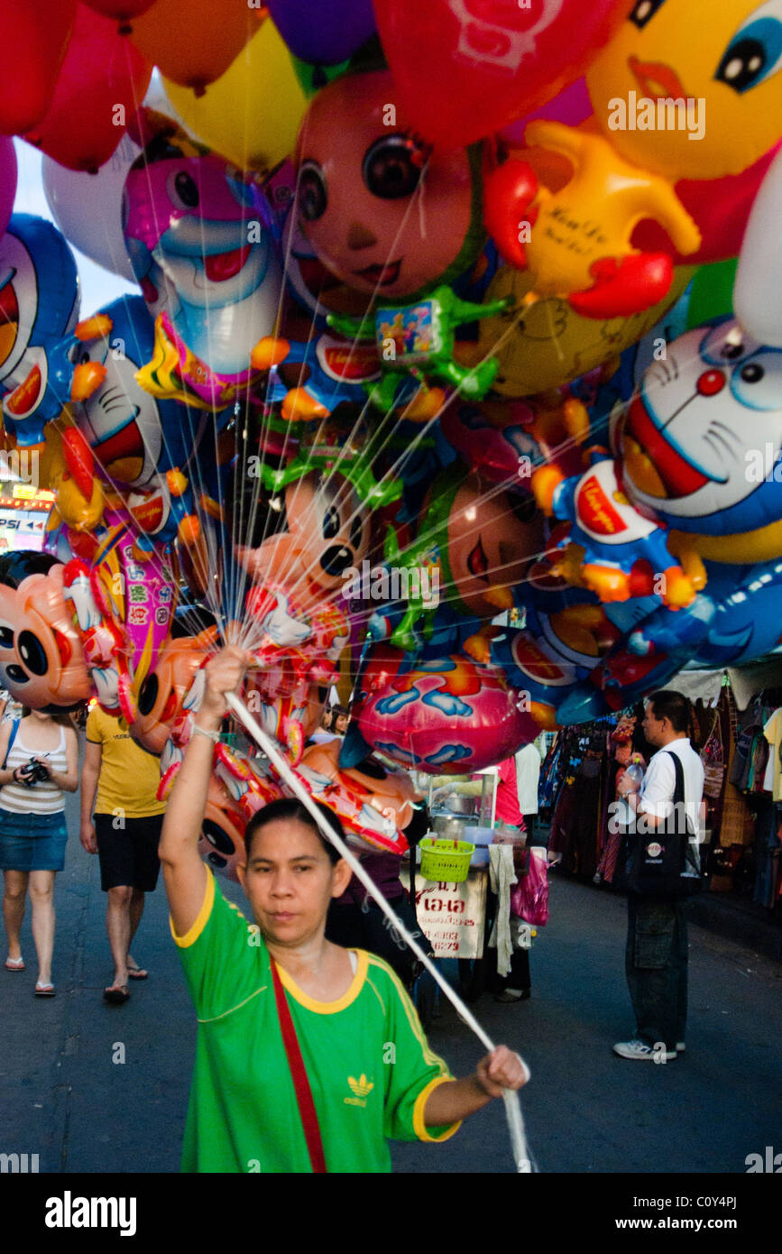 Woman selling balloons hi-res stock photography and images - Alamy