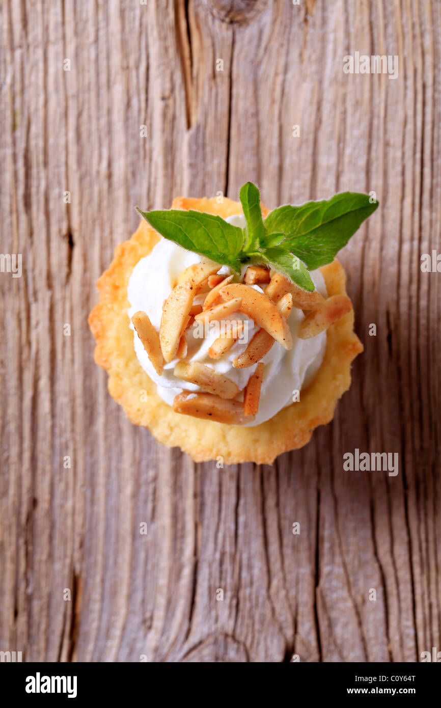 Canape - Pastry base with savory spread topping and roasted almonds ...