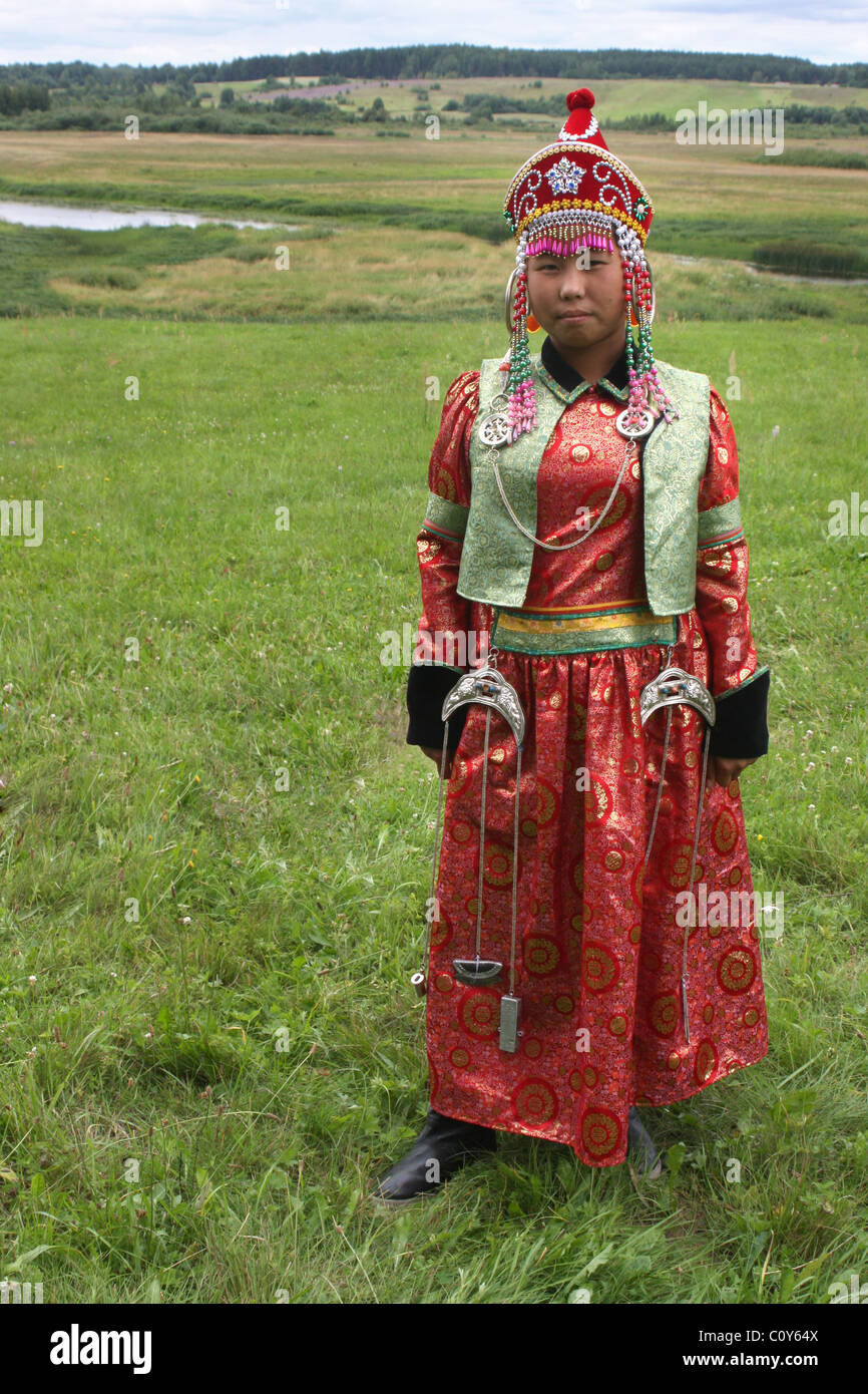 Girl in the Buryat national costume on a summer nature at folklore ...