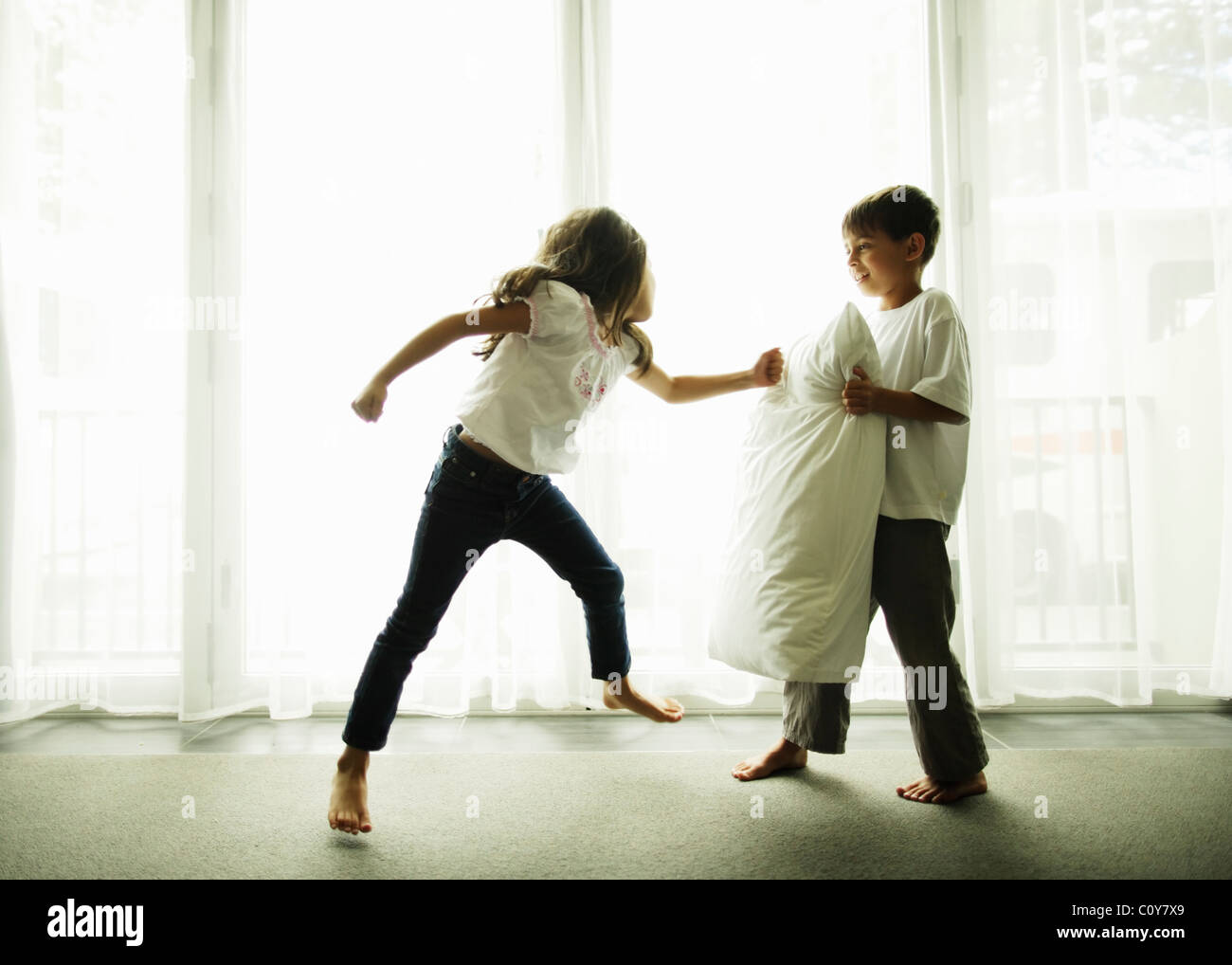 Girl punching pillow hi-res stock photography and images - Alamy