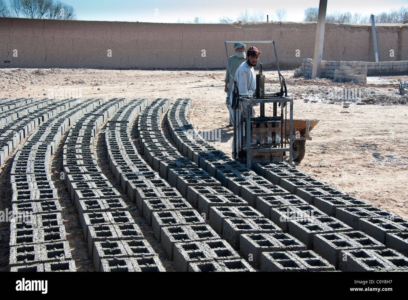 Making cinder building blocks, Helmand Afghanistan Stock Photo - Alamy