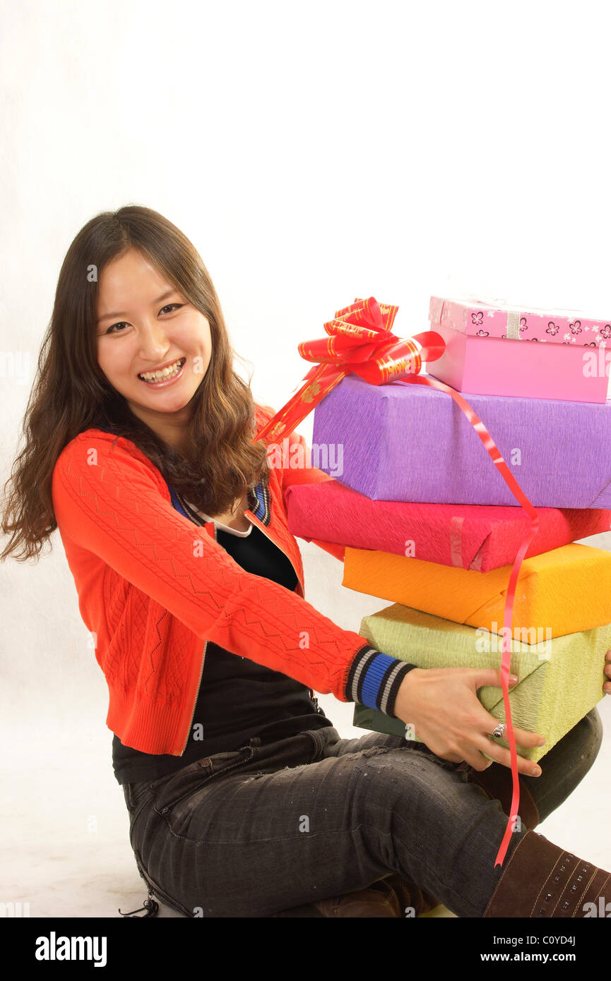 Happy girl holding her gift Stock Photo - Alamy