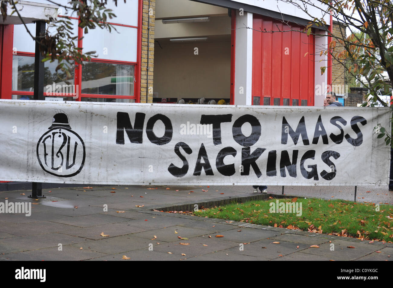 FBU members Strike. Hanging sign protesting against redundencies ...