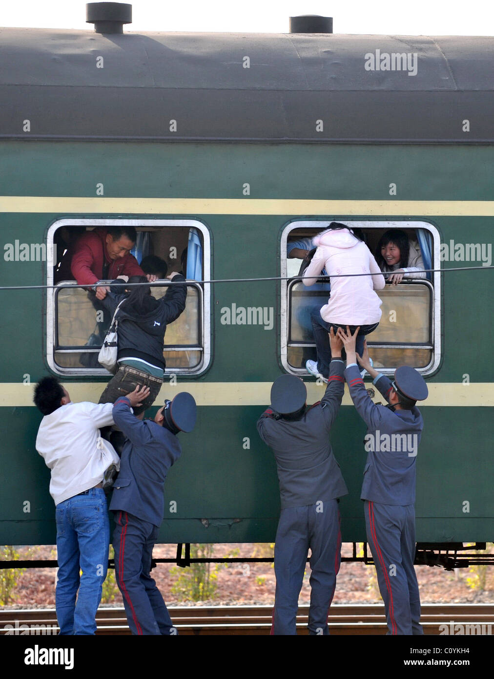 THAT'S RAIL-LY DANGEROUS... Desperate passengers try to scramble aboard ...