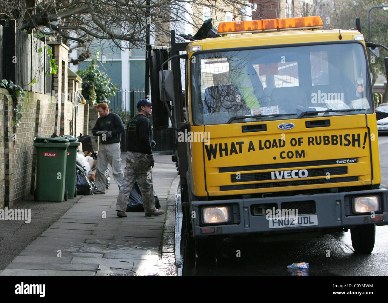 Bin men from a private waste management firm collect the massive amount ...