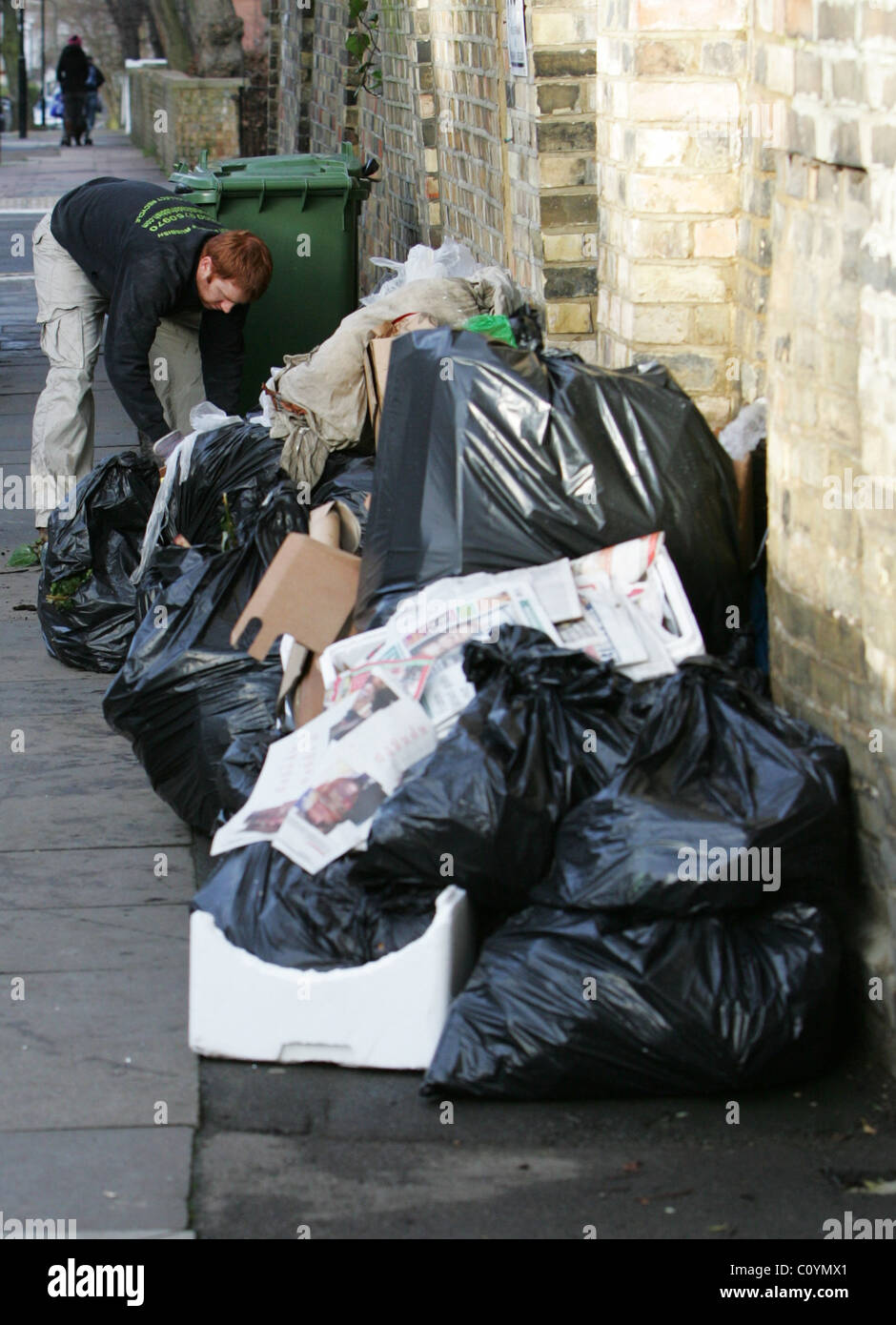 Bin men from a private waste management firm collect the massive amount ...