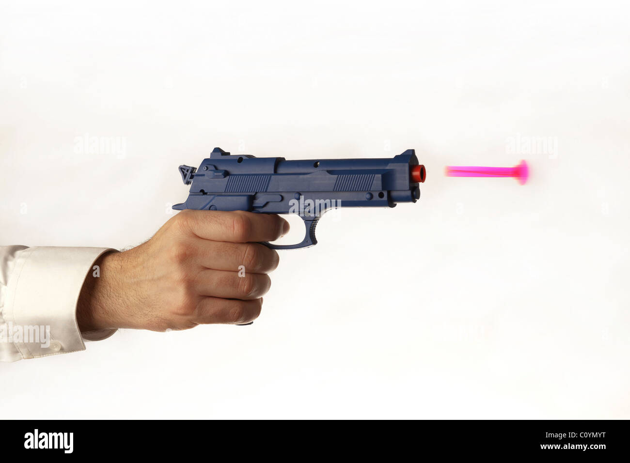 male hand holding a blue plastic toy gun Stock Photo - Alamy