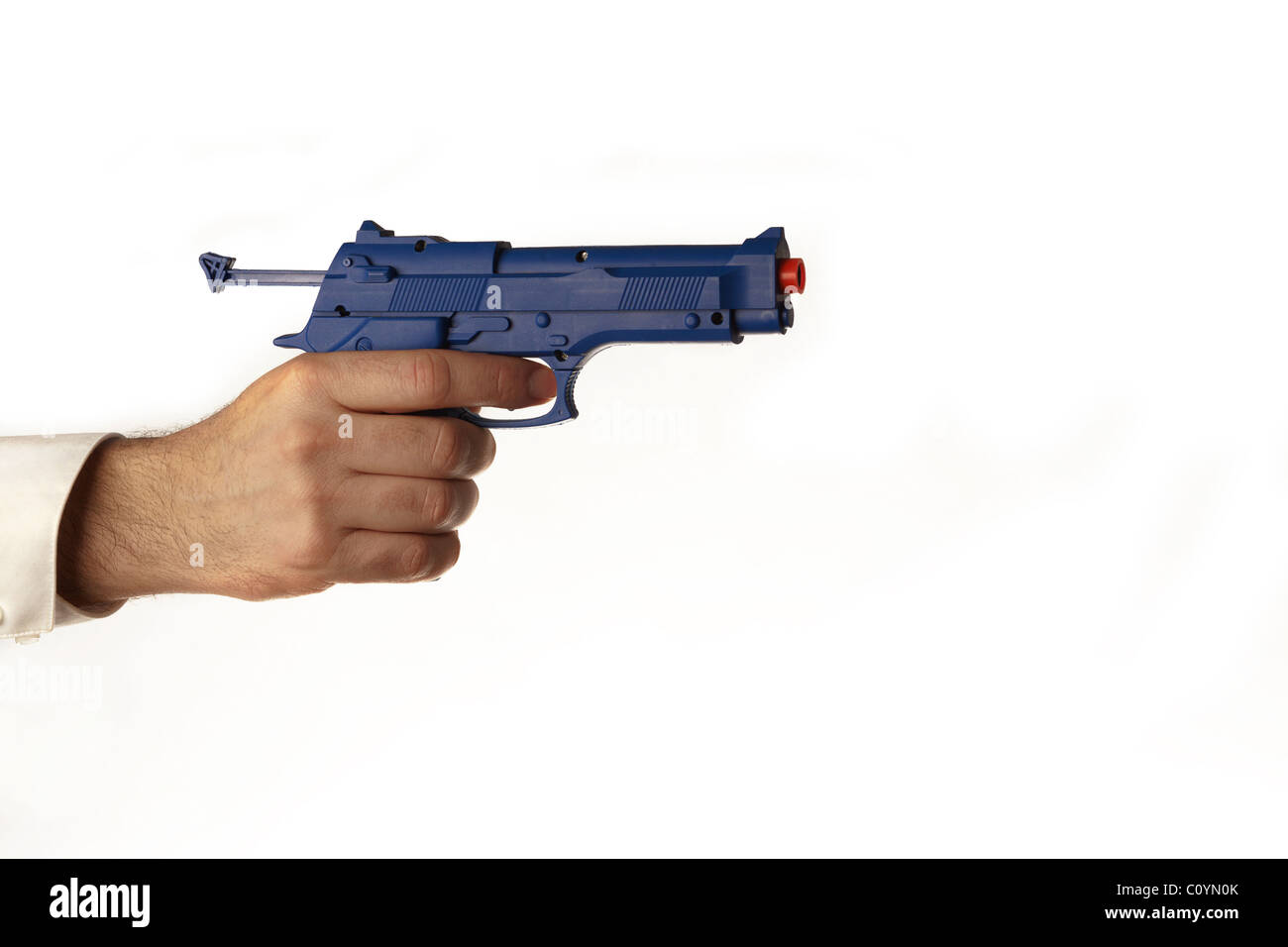 male hand holding a blue plastic toy gun Stock Photo - Alamy