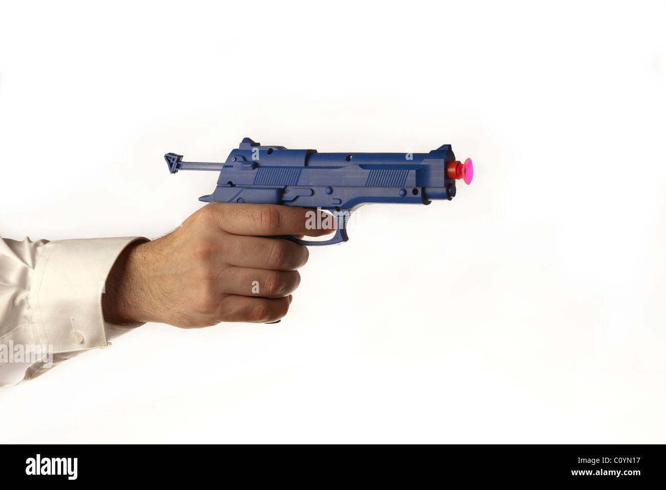 male hand holding a blue plastic toy gun Stock Photo - Alamy