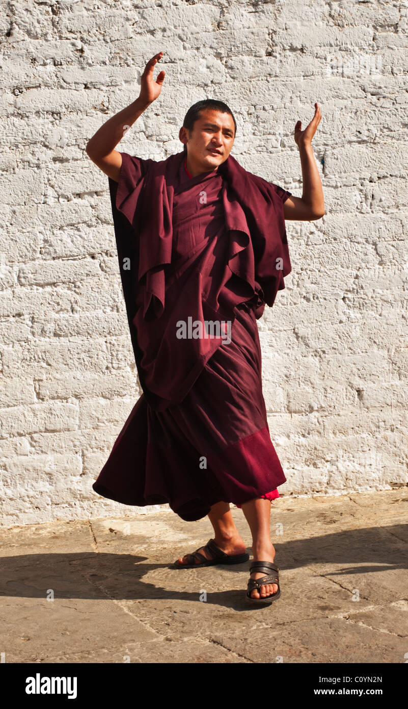 Bhutanese monk(s) practicing dance steps prior to appearing in a major ...