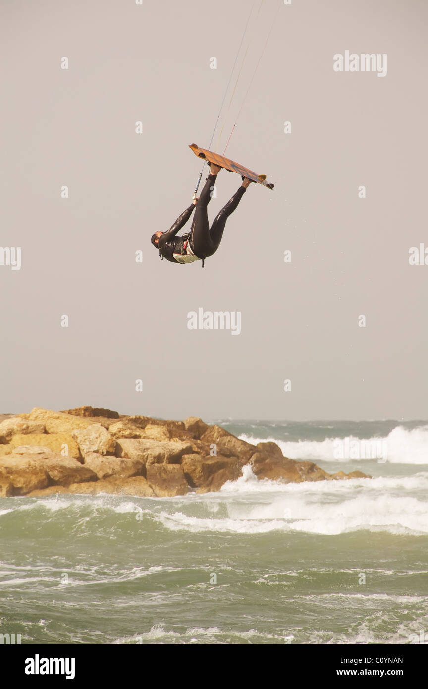 Kite surfer jumping on a gray winter day Stock Photo - Alamy