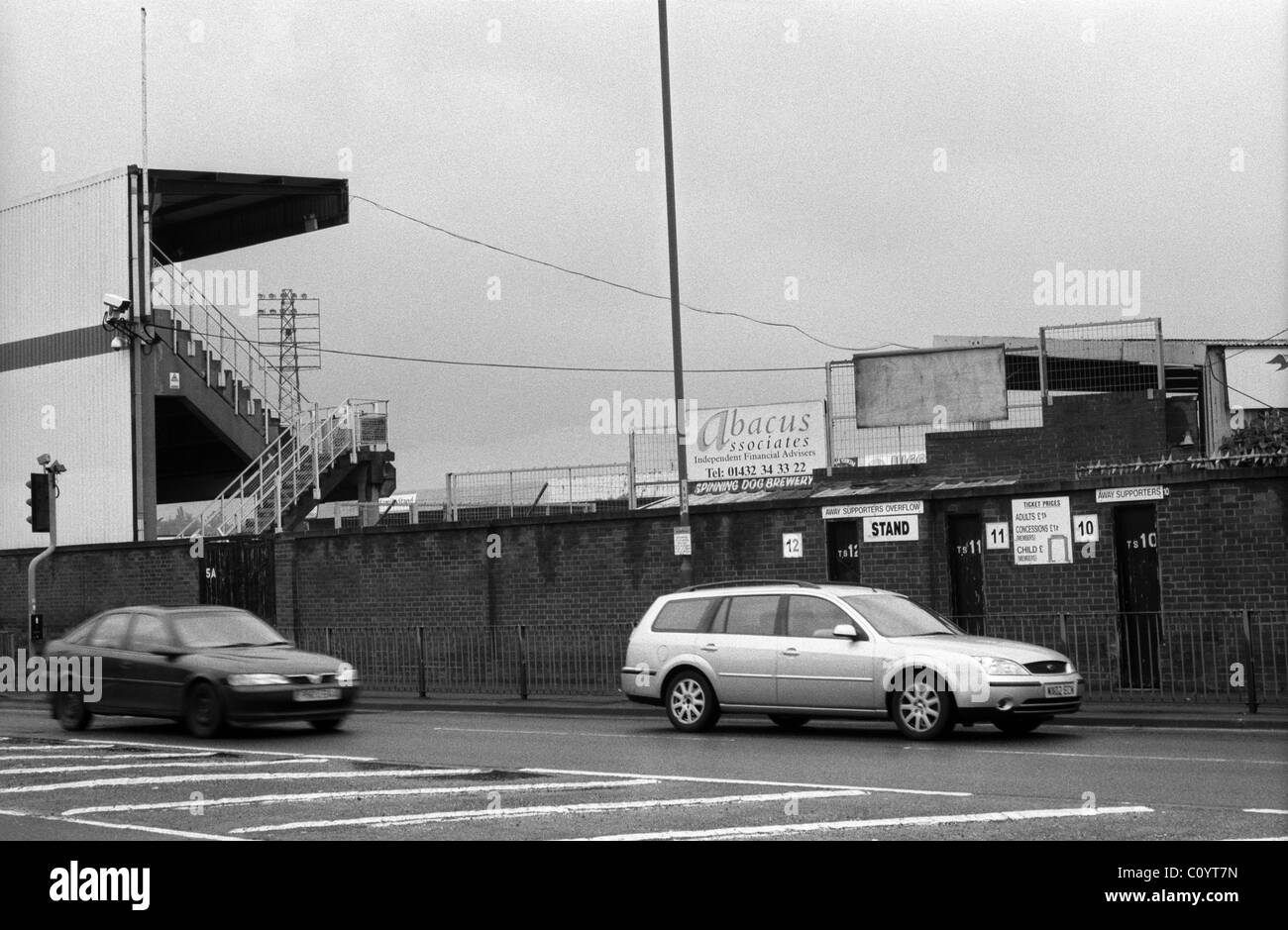 Cars driving past Hereford Football Stadium Stock Photo - Alamy