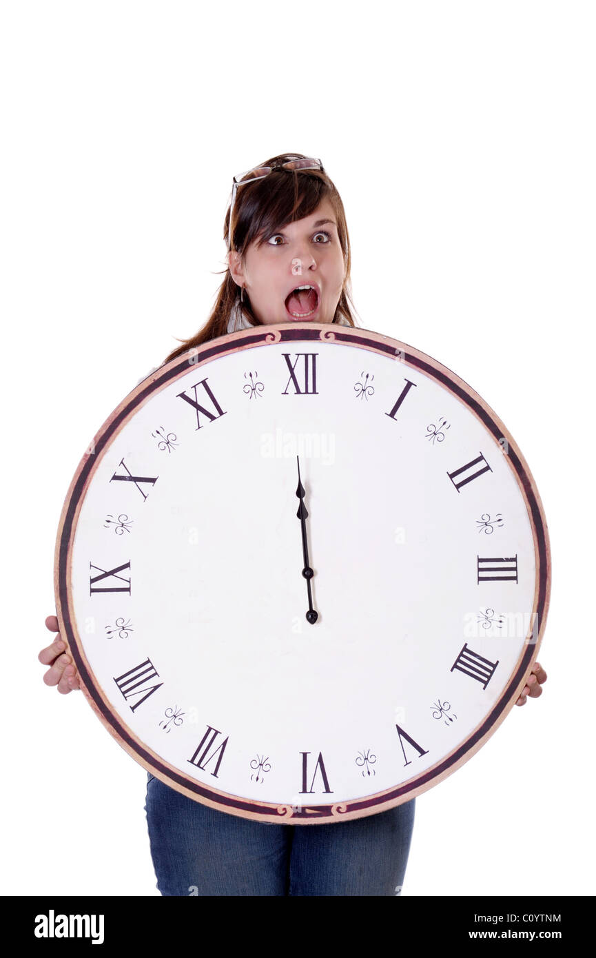 so late ! young woman with open mouth and clock showing midnight ...