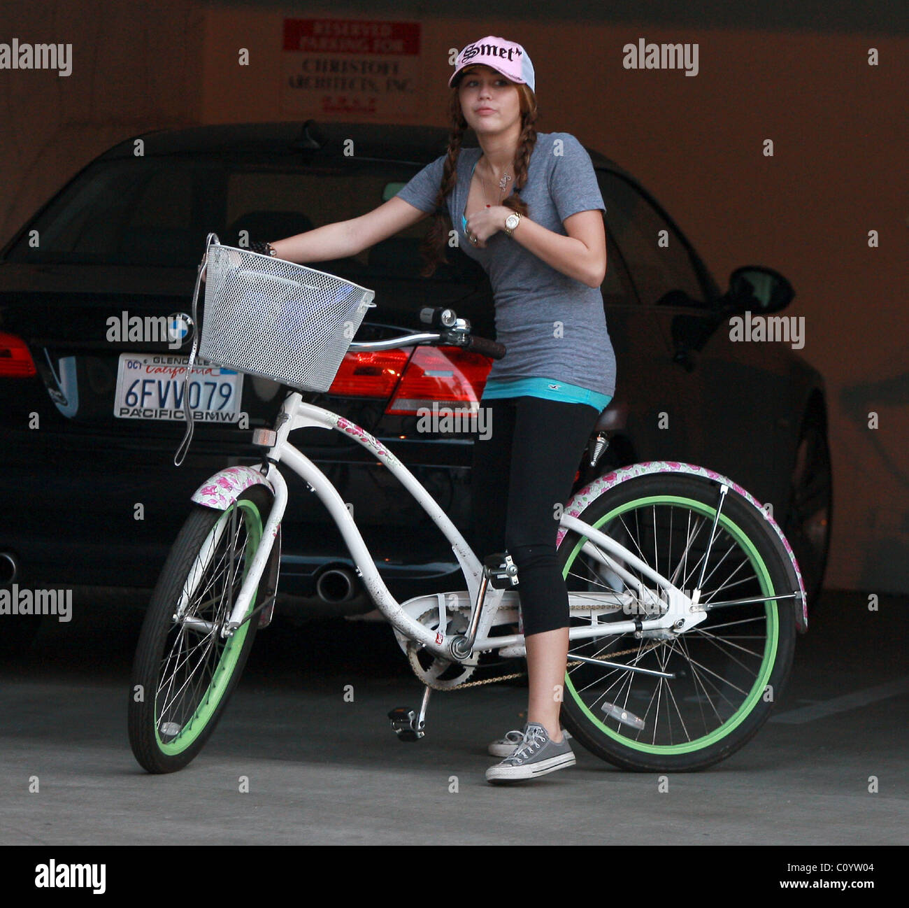 Miley Cyrus riding a bicycle in Toluca Lake Los Angeles, California ...