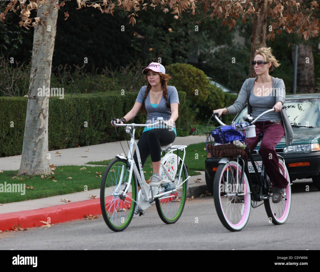Miley Cyrus riding a bicycle with her mother Leticia 'Tish' Cyrus in ...