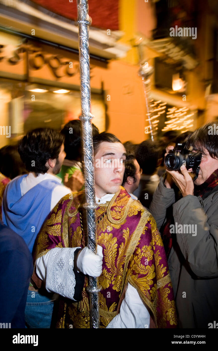 Photographer photographs member of Catholic church processing: Seville ...