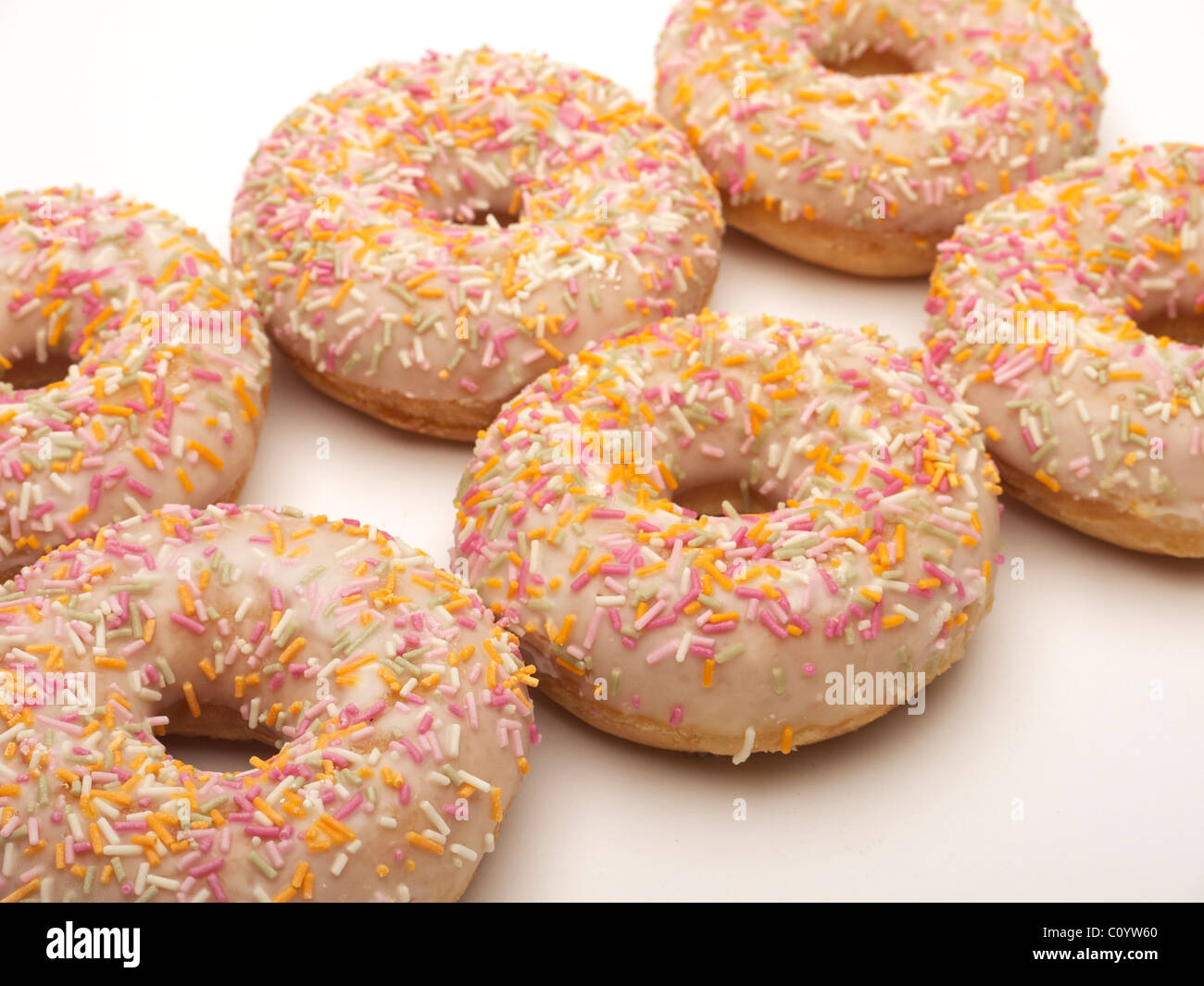 Six iced ring donuts with spinkles on Stock Photo - Alamy