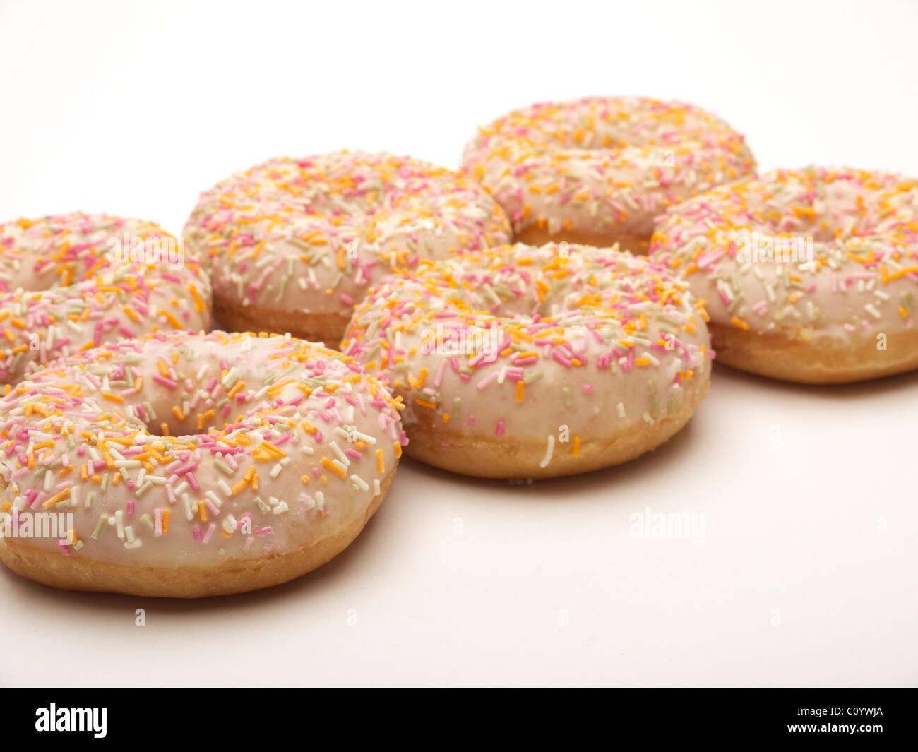 Six iced ring donuts with spinkles on Stock Photo - Alamy