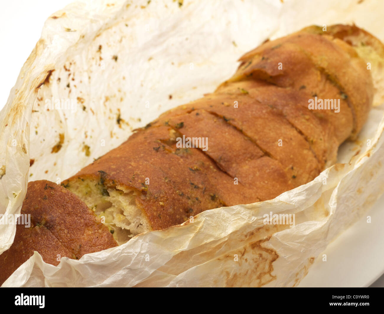 Home made Garlic bread in baking paper with chopped parsley Stock Photo ...