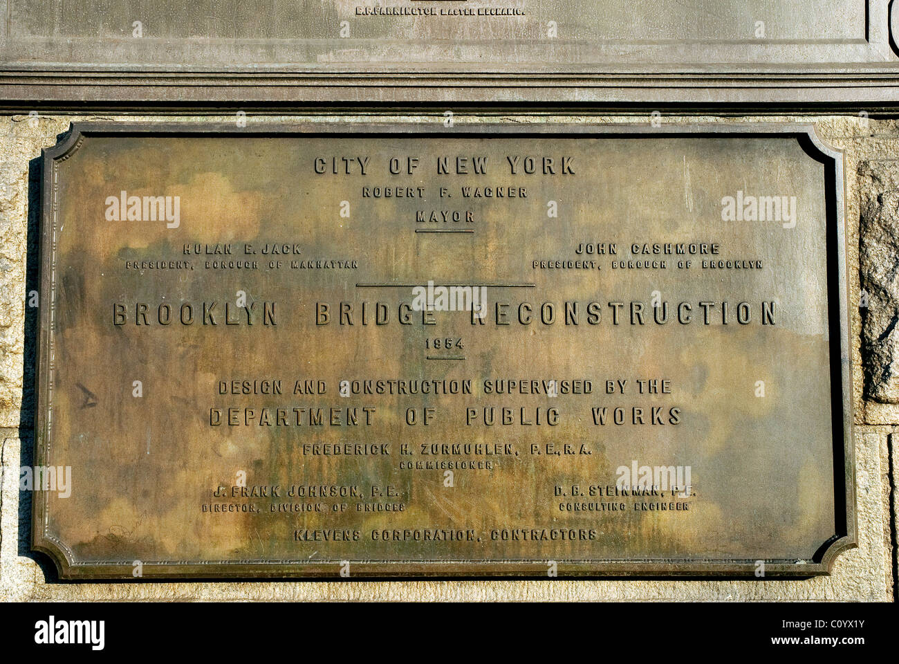 Brooklyn Bridge, New York City, Tourist photographing the plaque ...