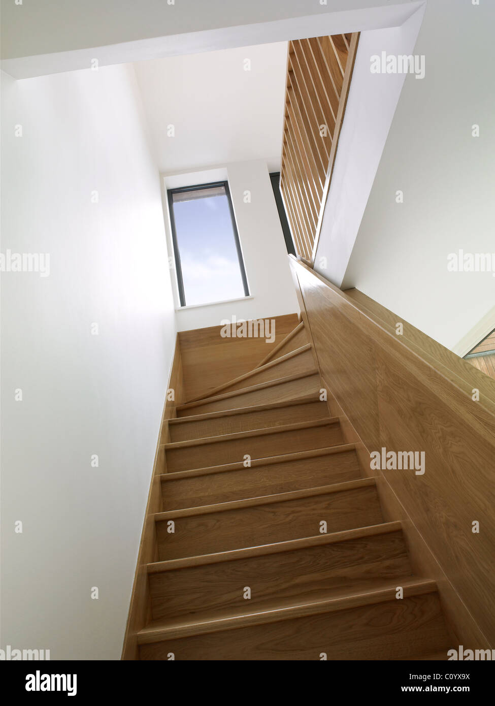 Interior shot looking up a staircase Stock Photo - Alamy