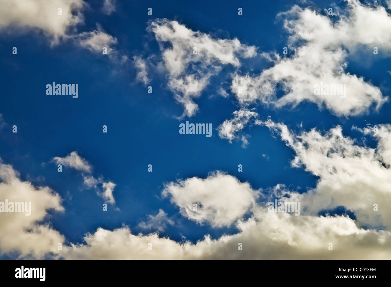 Clouds on a bright blue sky with a diagonal copy space Stock Photo - Alamy