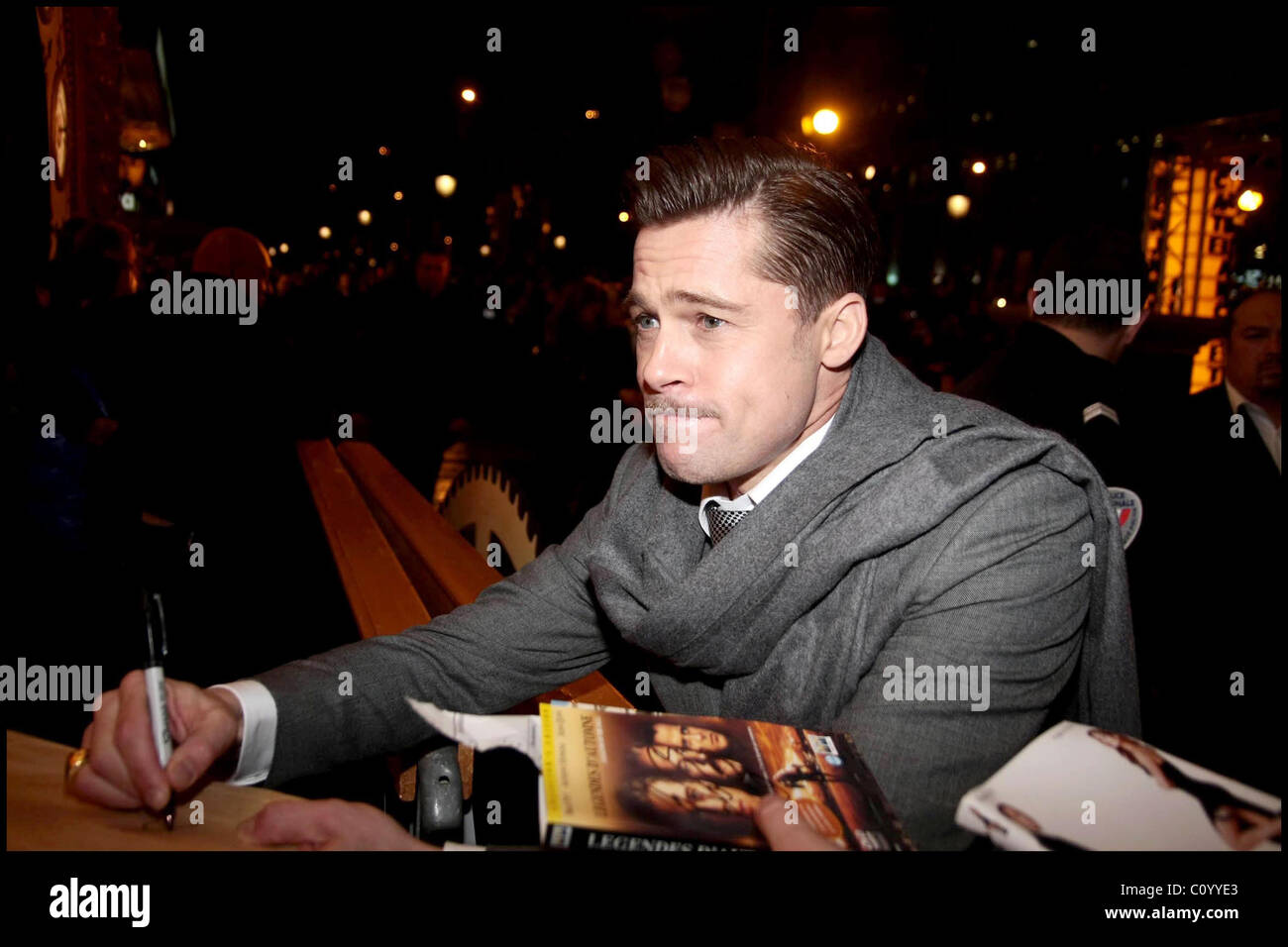 Brad Pitt signs autographs The Paris premiere of "The Curious Case Of ...