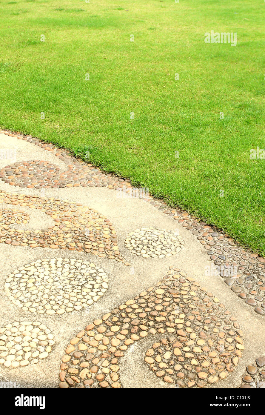 Garden stone path with grass Stock Photo - Alamy