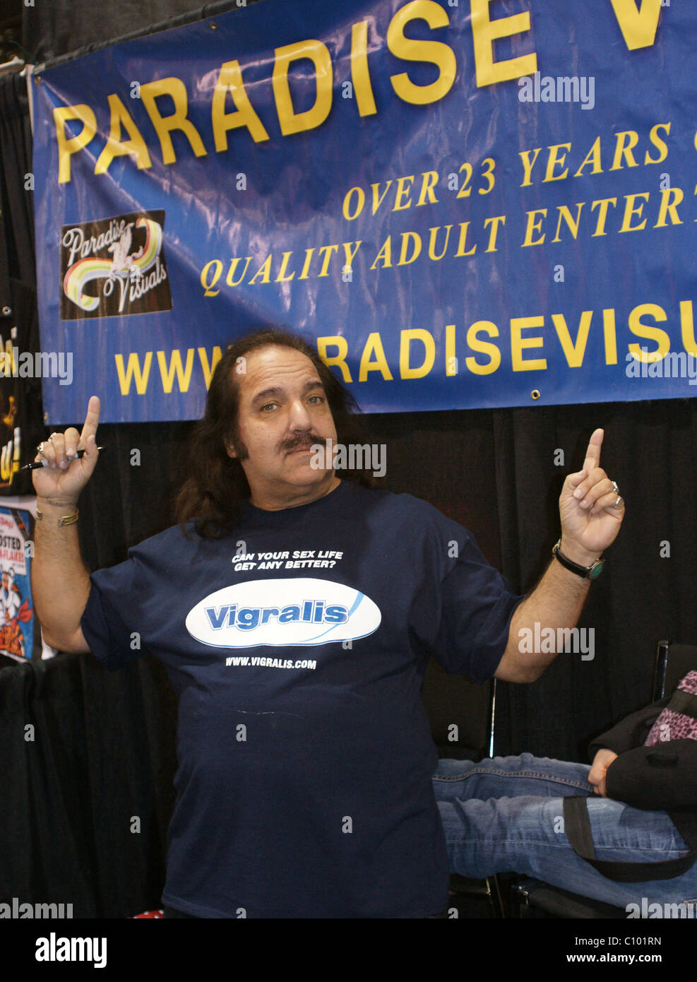 Ron Jeremy signs autographs at the Paradise Visuals booth at the Adult ...
