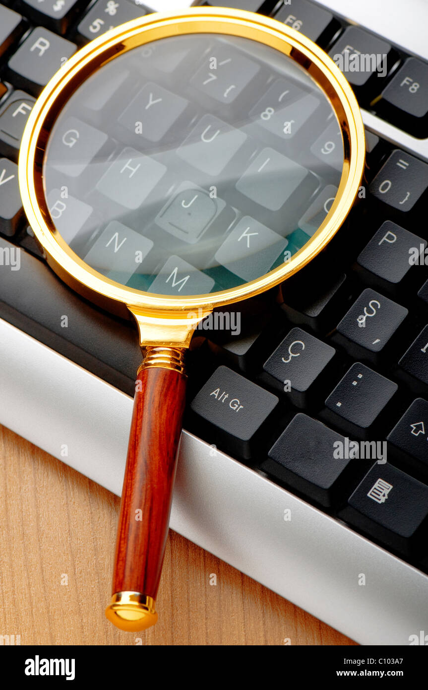 Computer security concept with keyboard and magnifying glass Stock ...