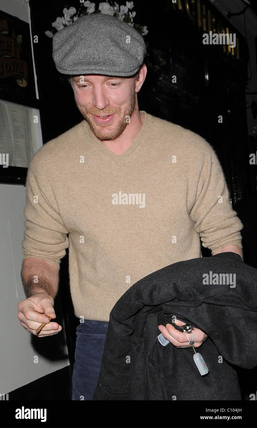 Guy Ritchie leaves his Punch Bowl in Mayfair alone, smoking a roll up ...
