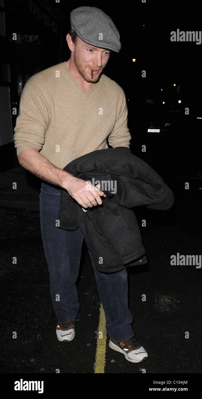 Guy Ritchie leaves his Punch Bowl in Mayfair alone, smoking a roll up ...
