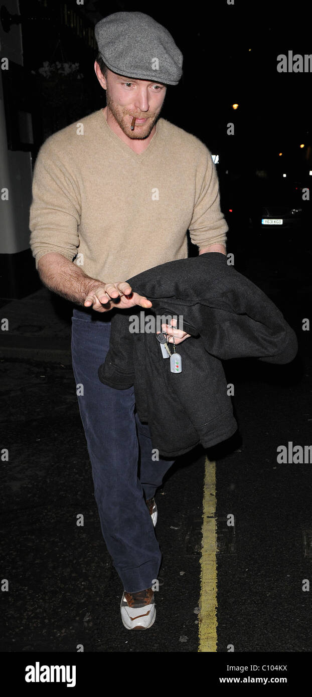 Guy Ritchie leaves his Punch Bowl in Mayfair alone, smoking a roll up ...