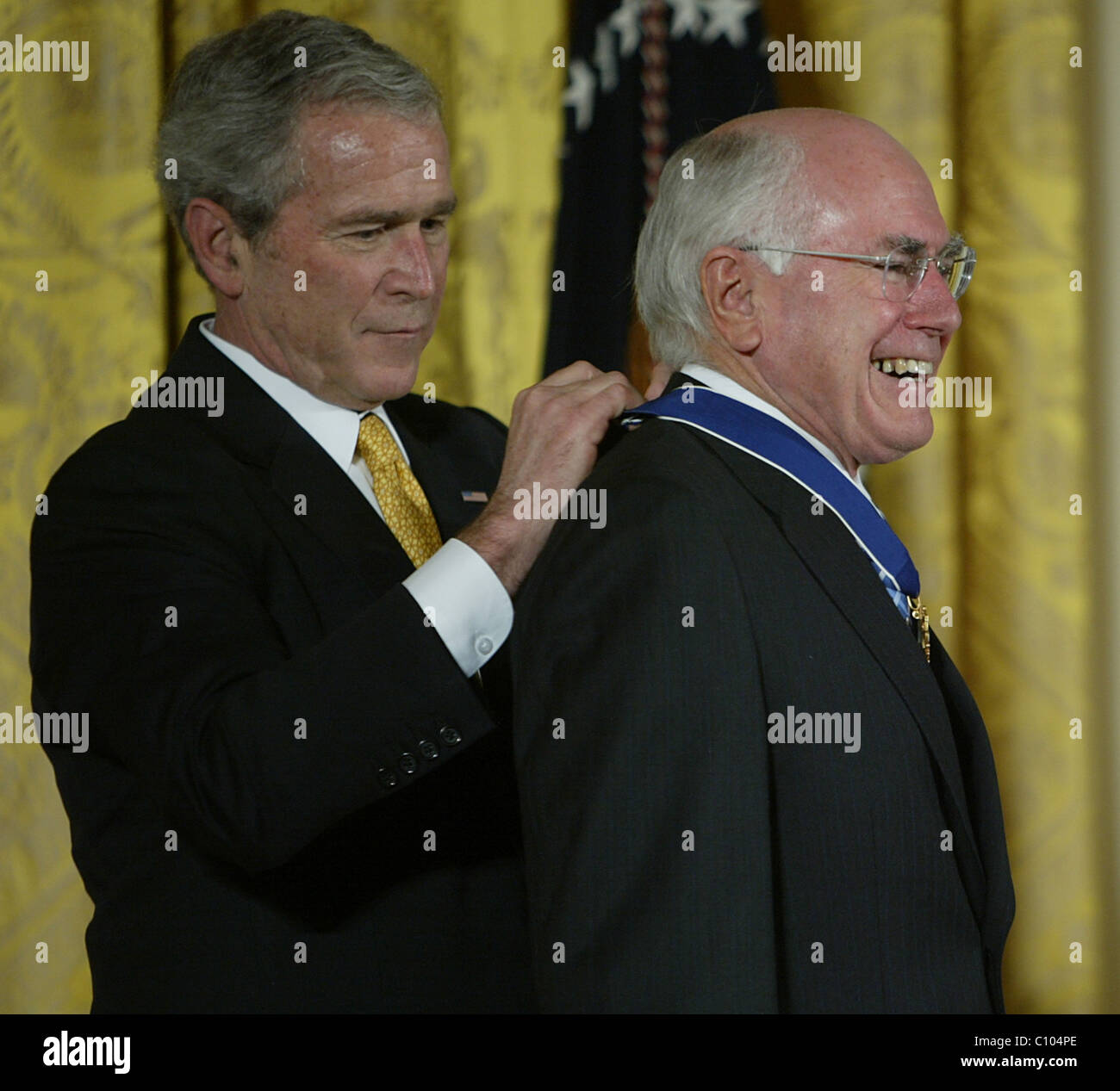 President George W. Bush presents former Australian Prime Minister John ...