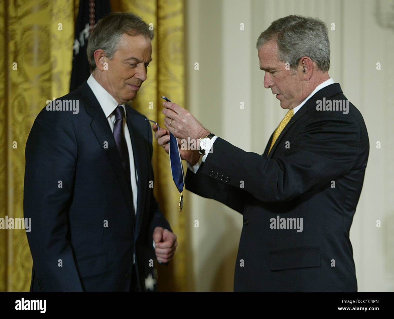 President George W. Bush presents the Medal of Freedom to former ...