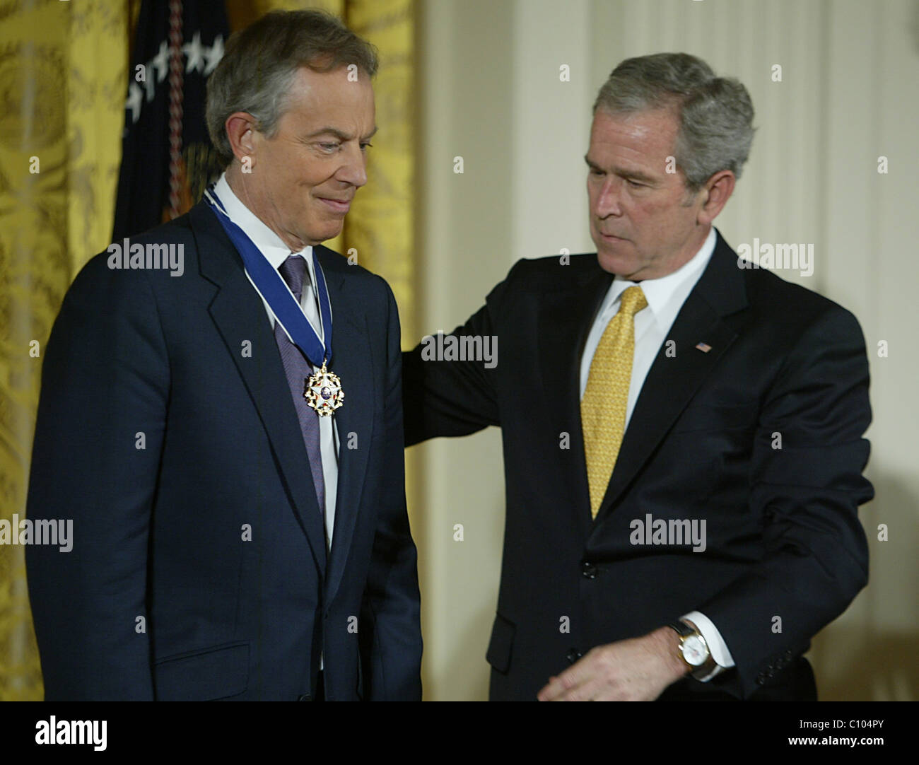 President George W. Bush presents the Medal of Freedom to former ...