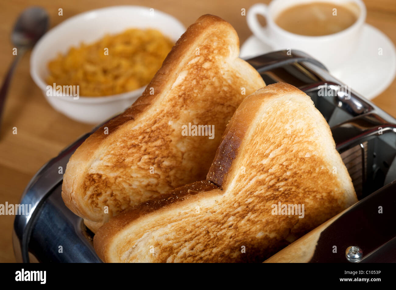 Toast in toaster Stock Photo - Alamy