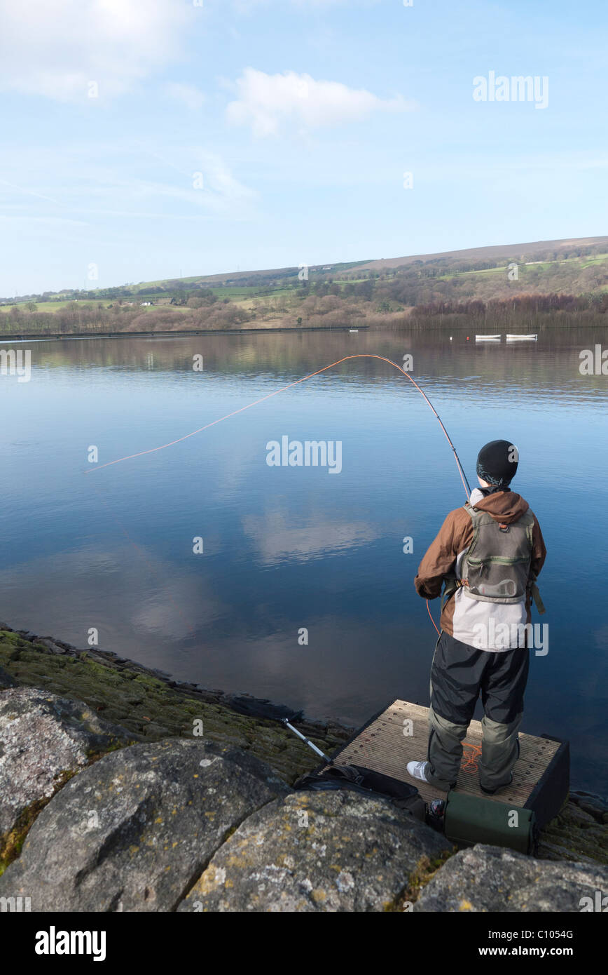 Young angler hooking a Trout. Derbyshire, England, UK Stock Photo - Alamy