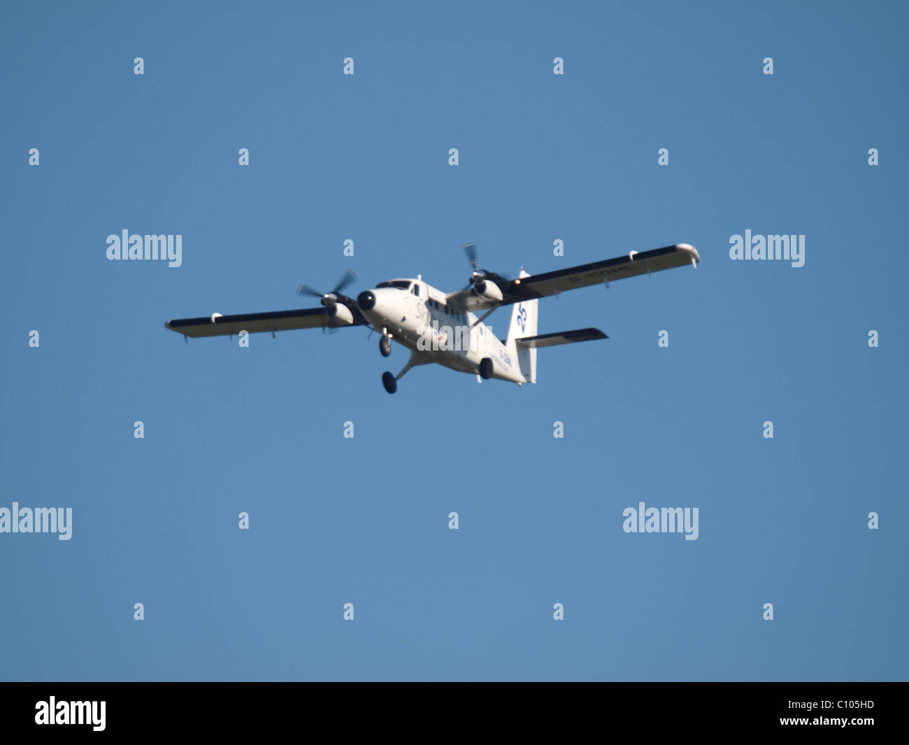 Skybus plane in flight, UK Stock Photo - Alamy