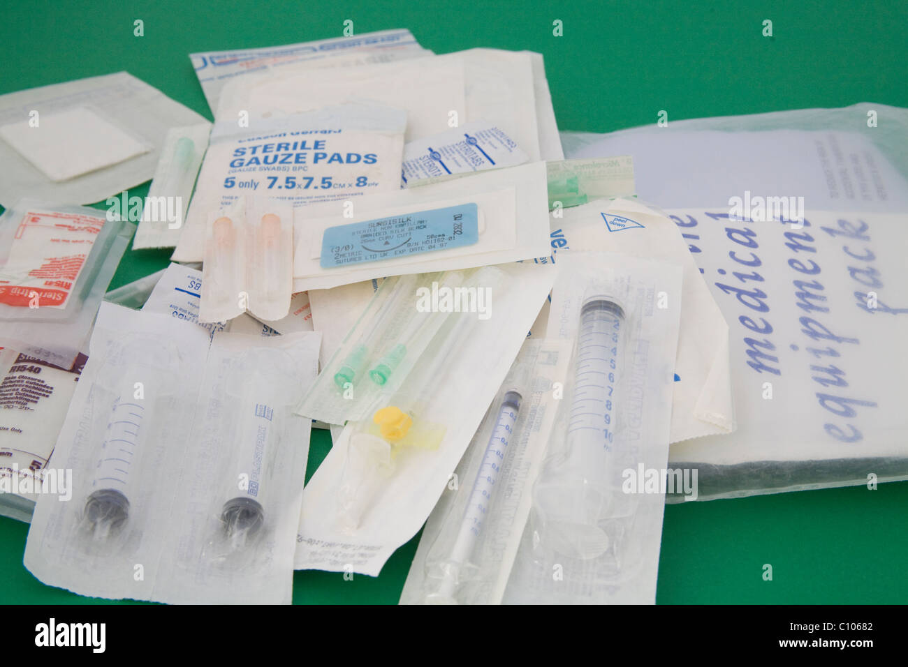 Close up medical equipment pack containing syringes cannula needles ...