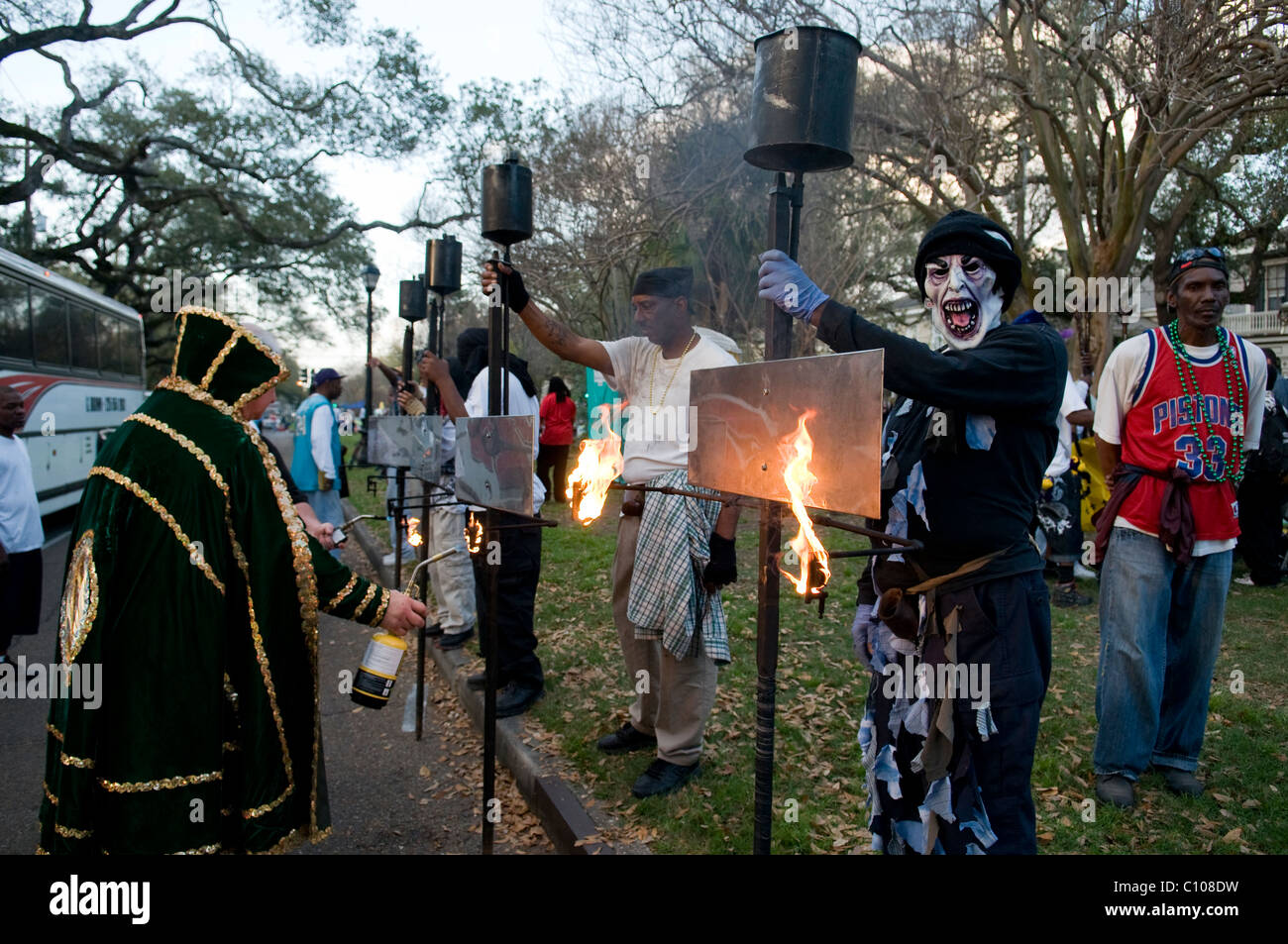 Lighting of flames; Krewe of Sparta Flambeauxs, Mardi Gras 2011 Stock ...