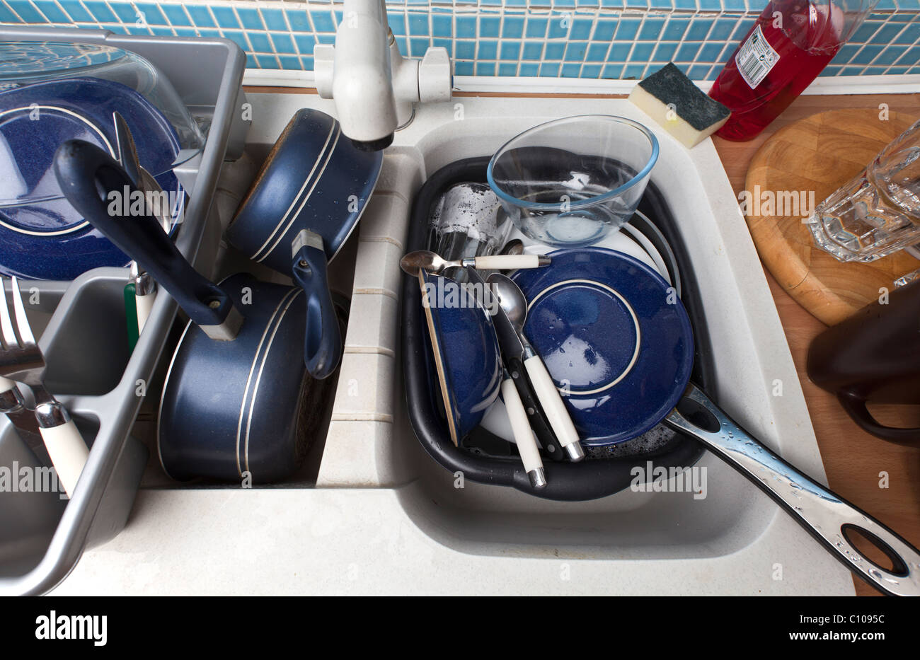 a kitchen sink full of dishes Stock Photo - Alamy