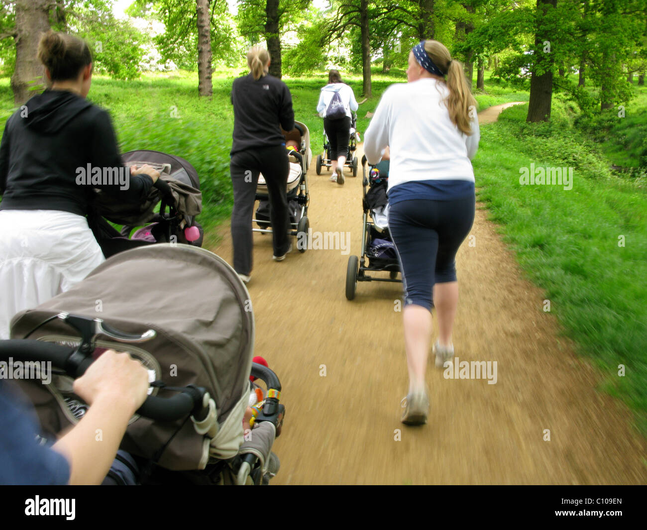 Mothers pushing buggy's during an outdoor exercise class Stock Photo ...