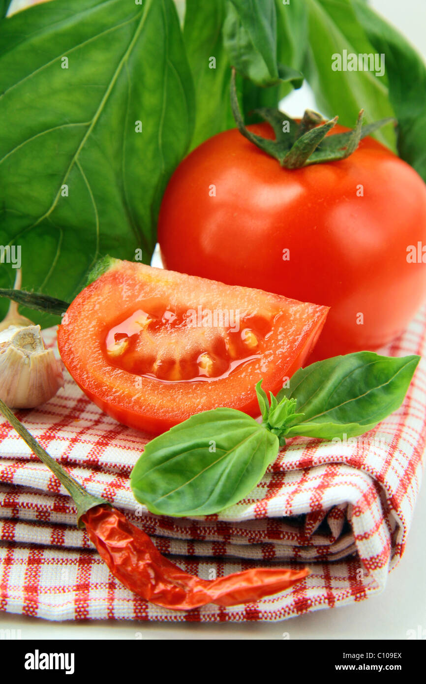 Fresh ripe tomatoes with basil and olive oil Stock Photo - Alamy
