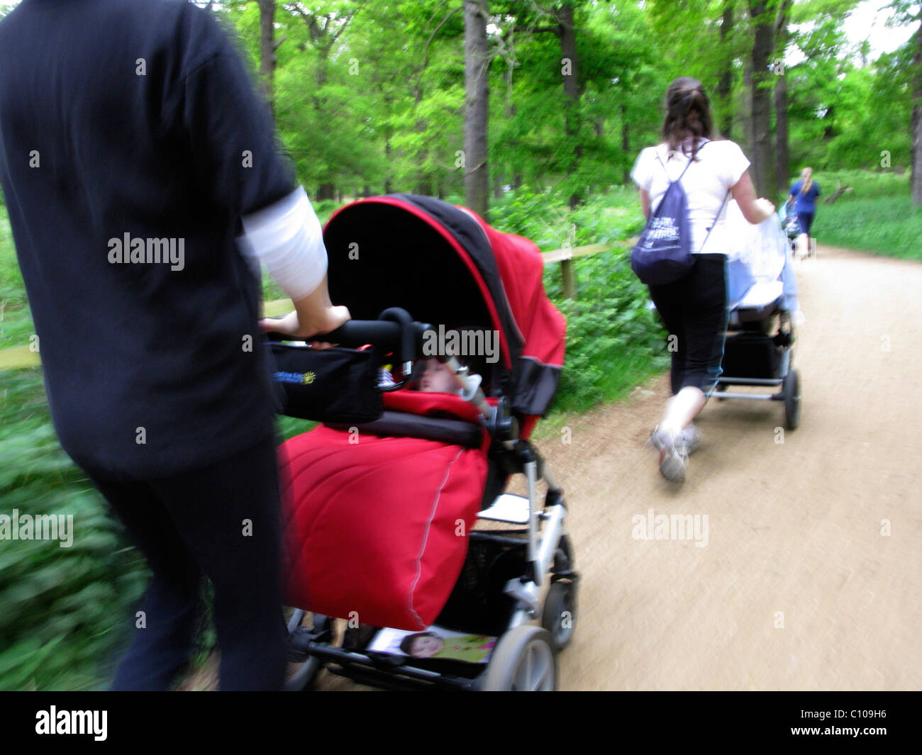 Mothers pushing buggy's during an outdoor exercise class Stock Photo ...