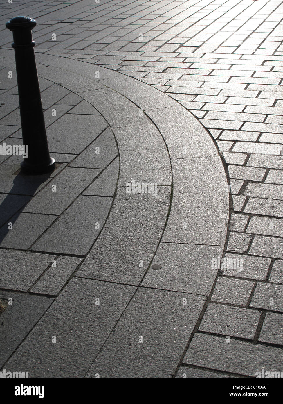 Curved granite paving Stock Photo - Alamy
