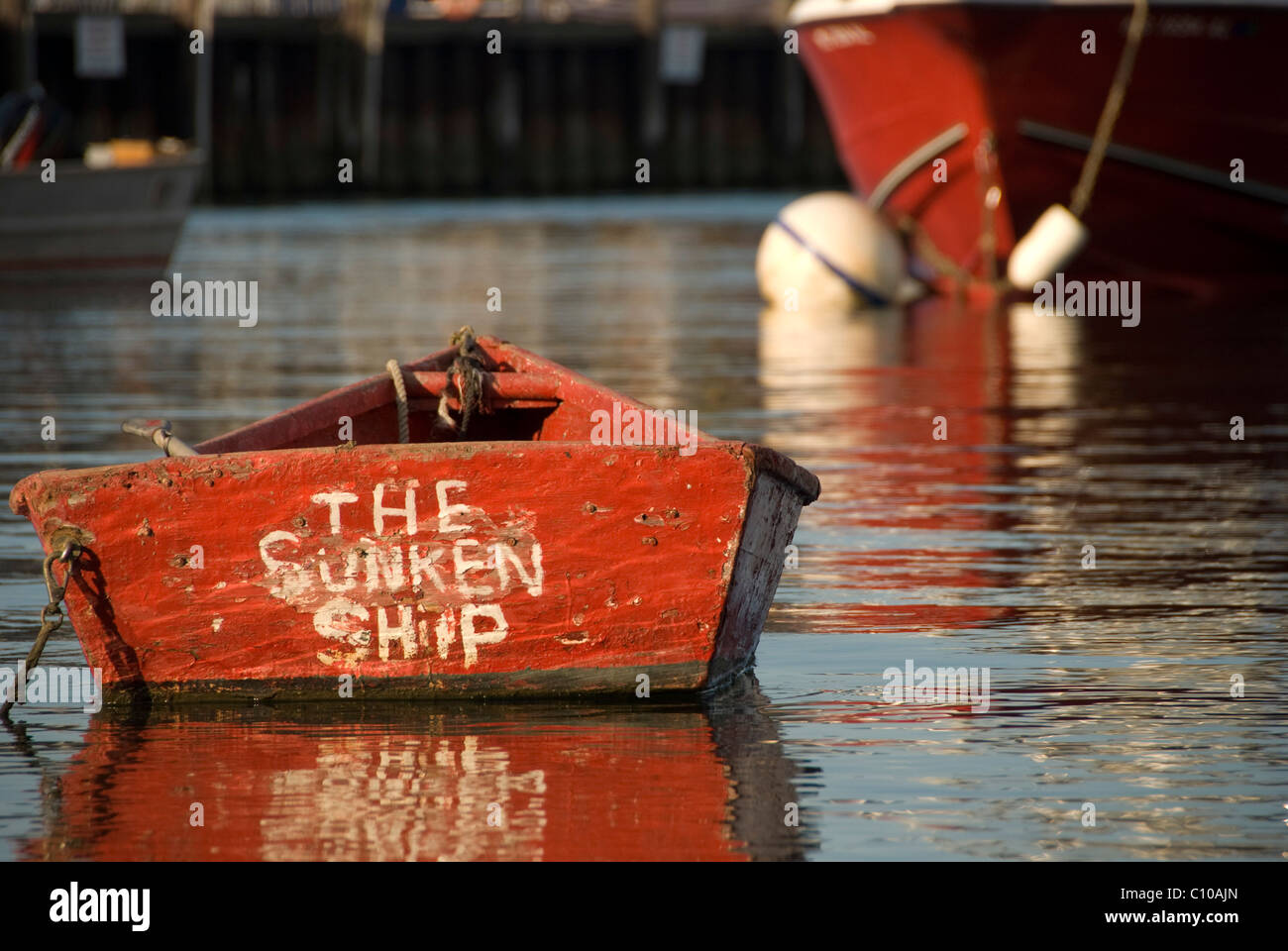 A small red boat at sunset in Nantucket, MA Stock Photo - Alamy